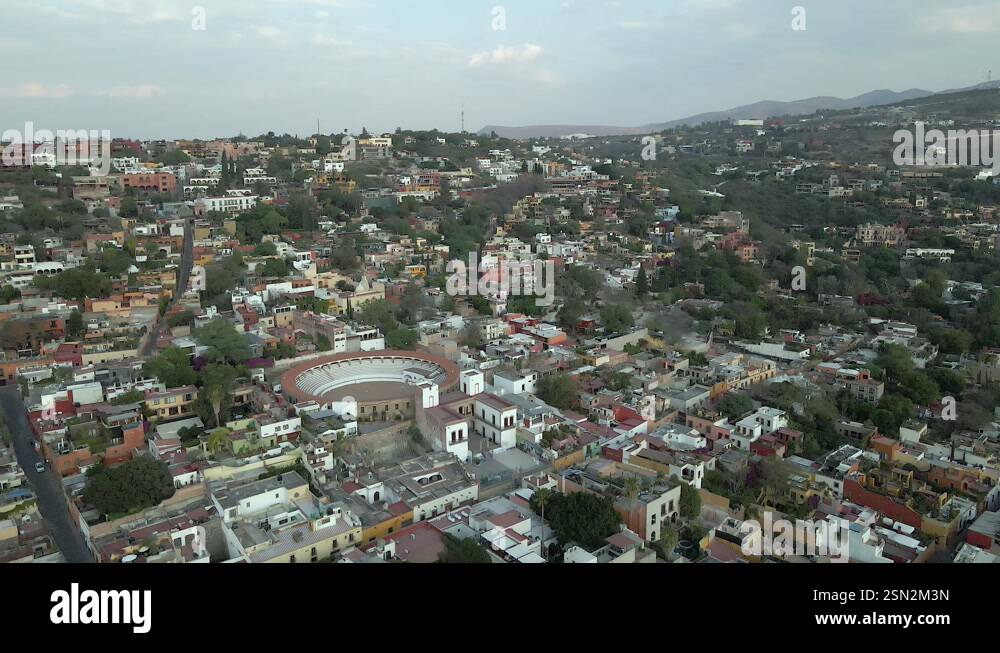 Flyover San Miguel Mexico rooftops to Plaza de Toros bullring arena ...