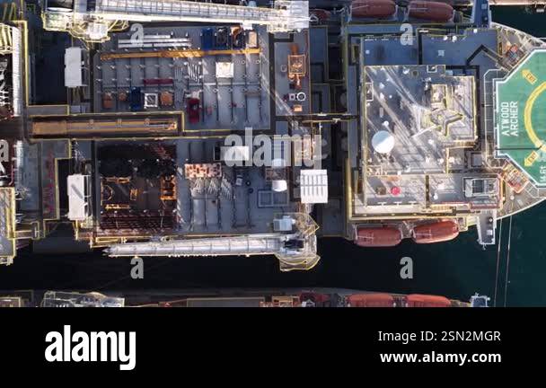 Aerial view reveals detailed layout of an offshore vessel with various ...