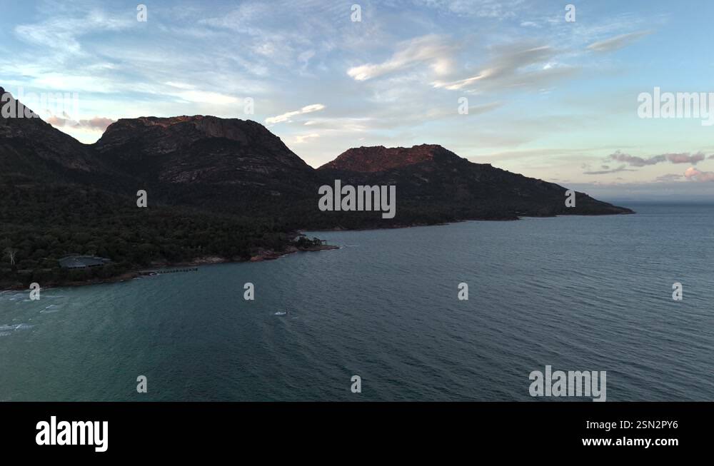 Coles Bay and mountains at sunset, east coast of Tasmania. Aerial drone ...