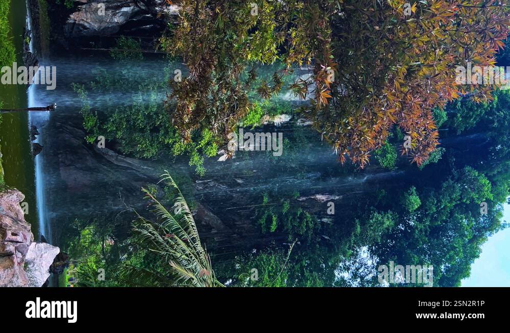 Vertical View Of Man-Made Waterfall In Gunung Lang Recreational Park In Stock Video Footage - Alamy
