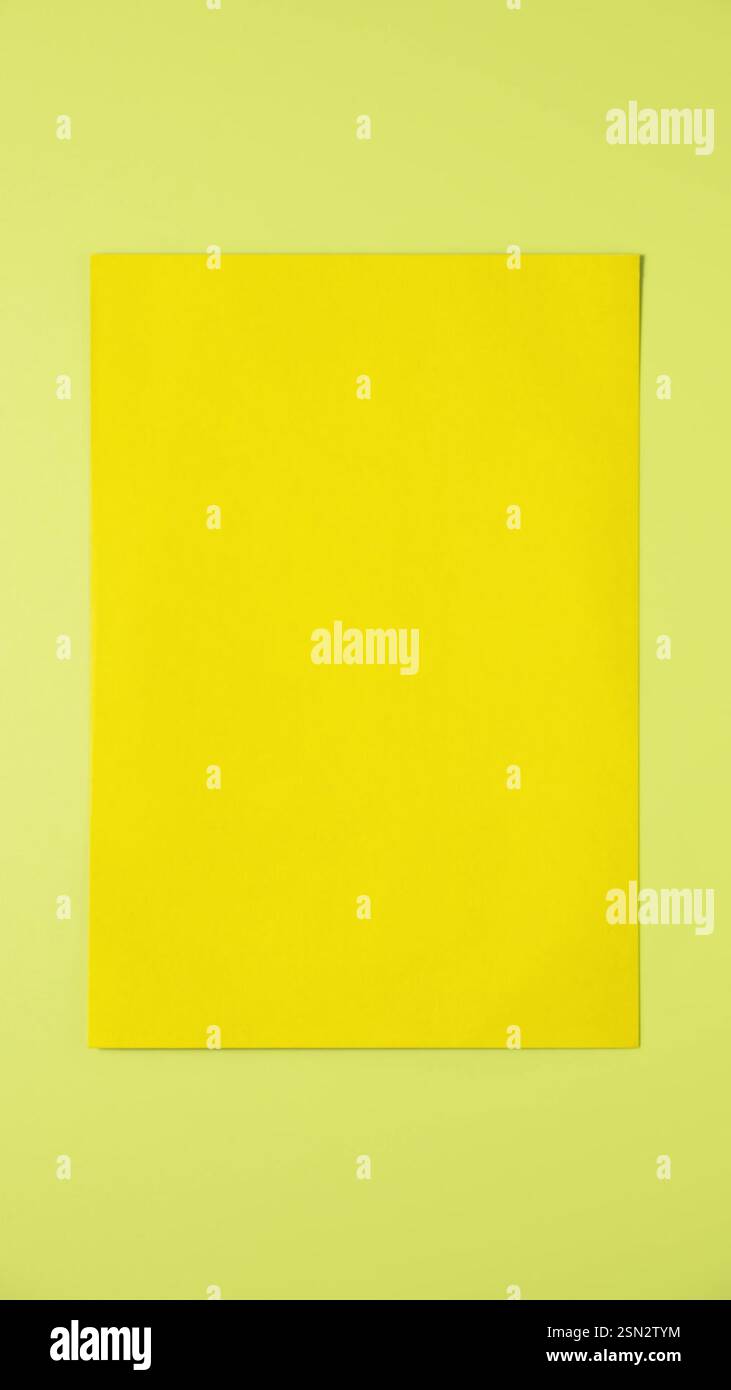 Yellow paper sheet for mockup on green background Stock Video Footage - Alamy