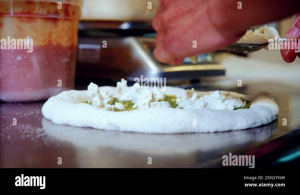Authentic pizza making process in traditional Italian pizzeria, with ...