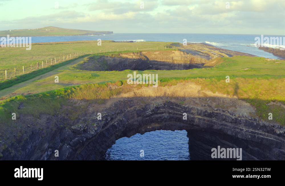 Sunrise casts a full-body shadow walking across the Bridges of Ross ...