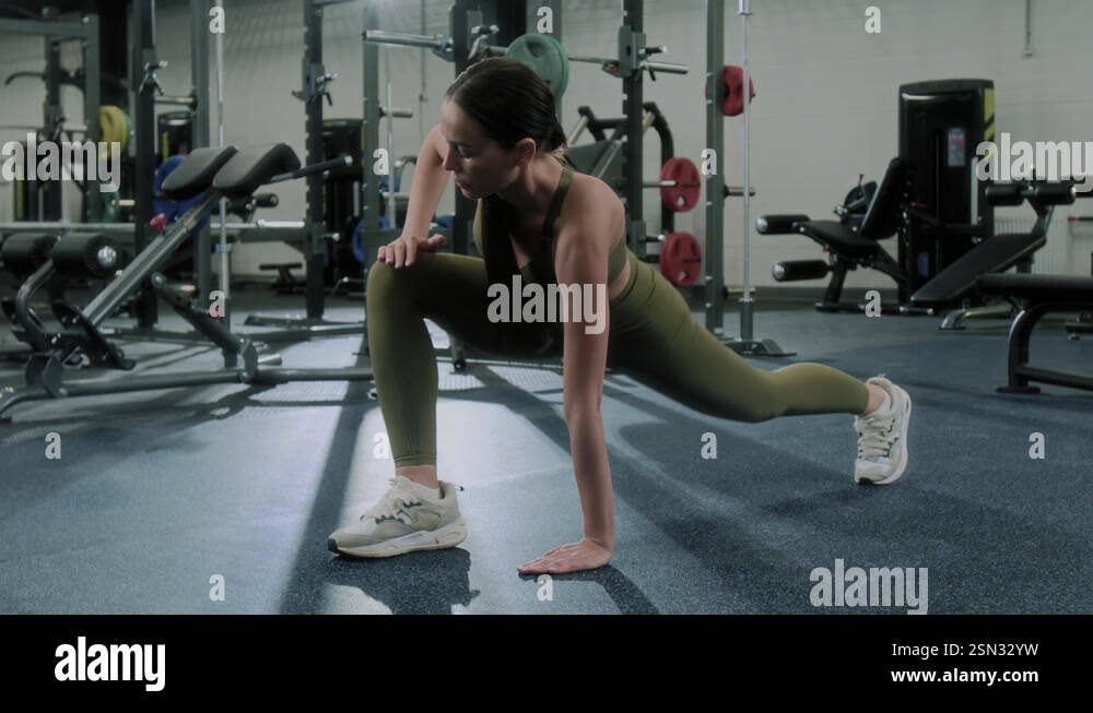 Sportswoman doing lunge hamstring stretch Stock Videos & Footage - HD ...