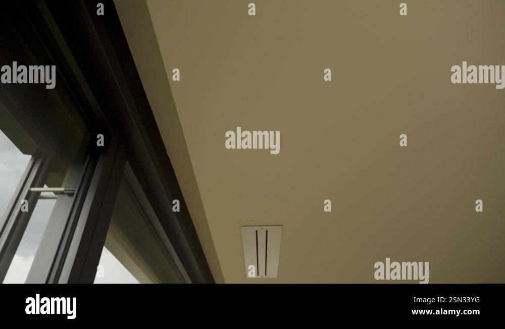 Slow tilting revealing shot of aircon vents at the window of a luxury ...