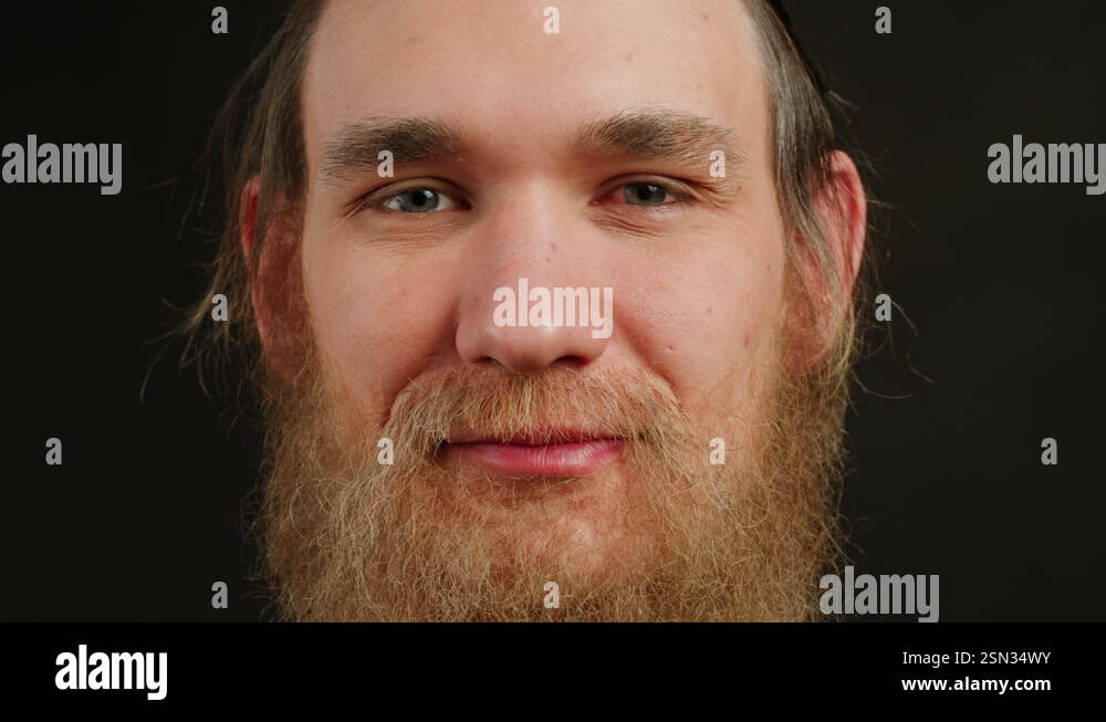 Make up artist making Disheveled blond beard for a man in theater with ...