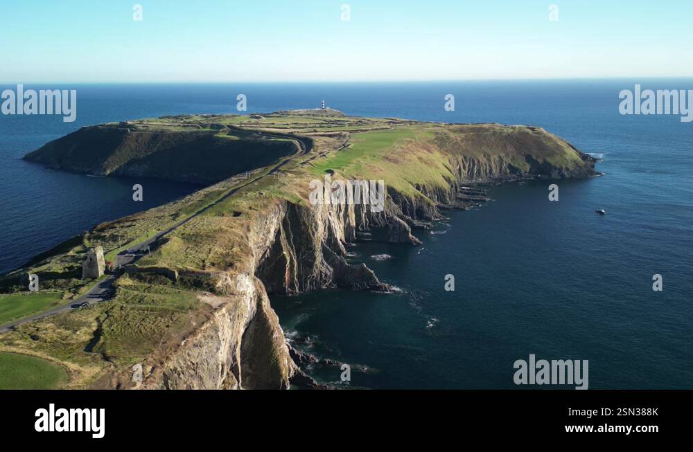Dramatic cliffs, calm blue ocean Old Head headlands with golf course ...