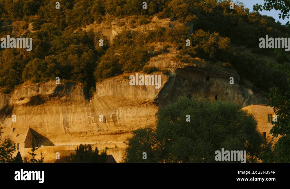 Beautiful Sunset Golden Lighting of Cliff with Houses Built into the ...