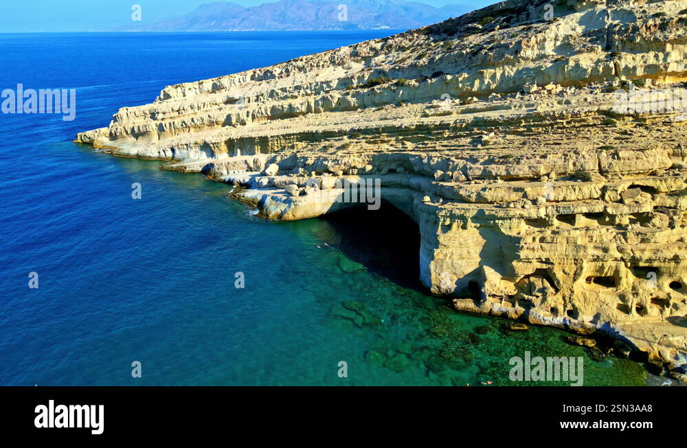 The artificial caves in the cliff of Matala Bay, Crete, Greece were ...