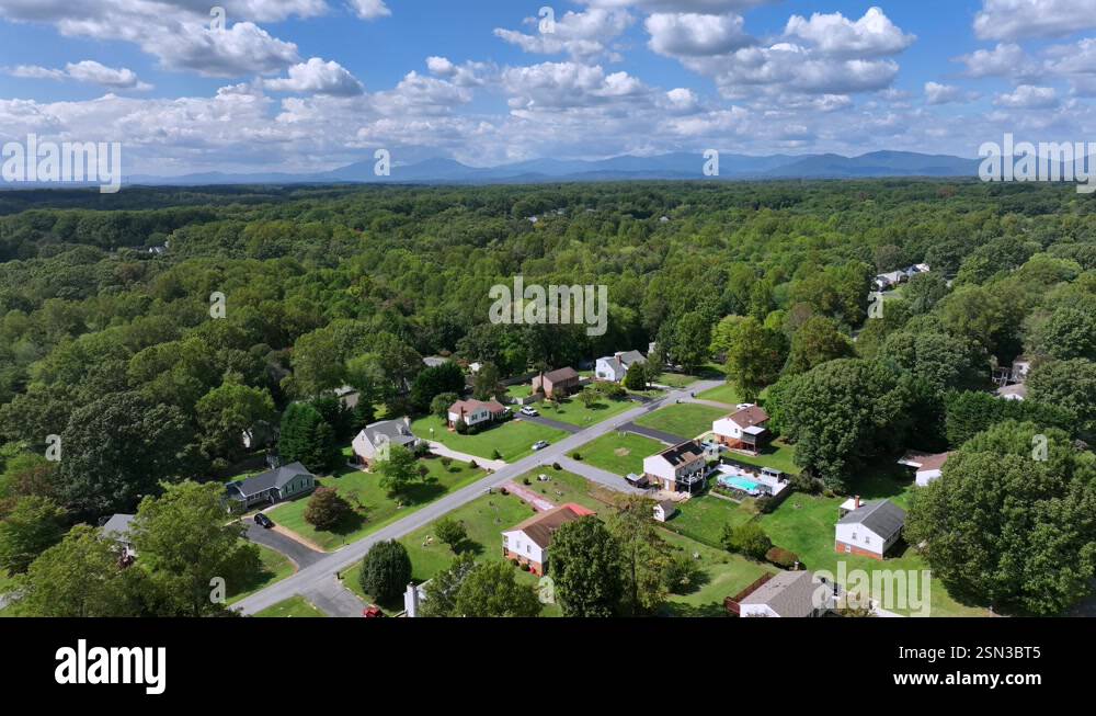 Large suburb real estates in rural area with forest trees. Sunny day ...