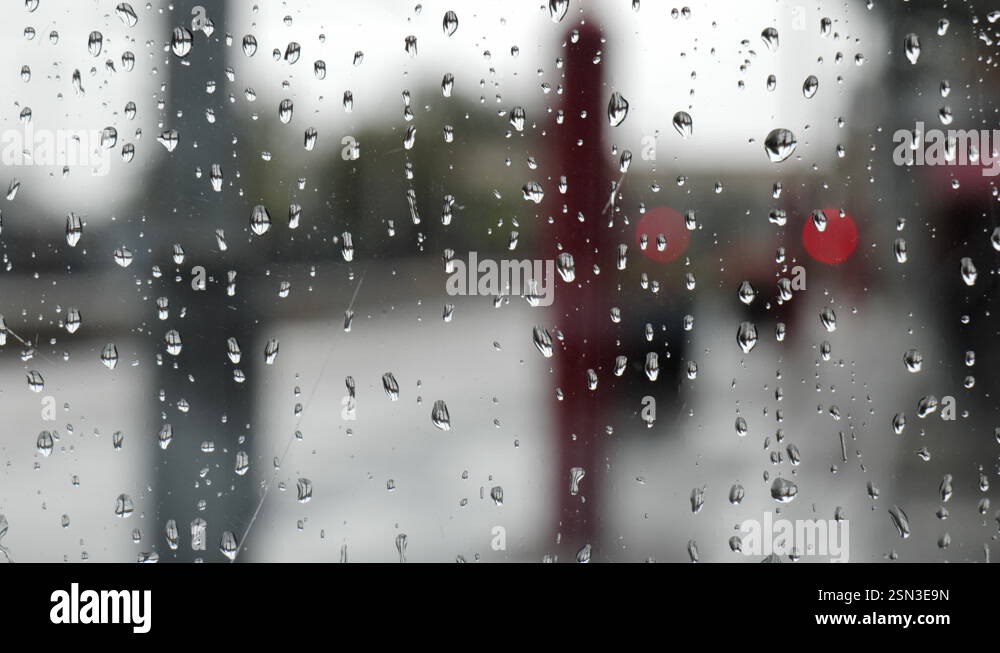 Rain dripping down window at railway station Stock Video Footage - Alamy