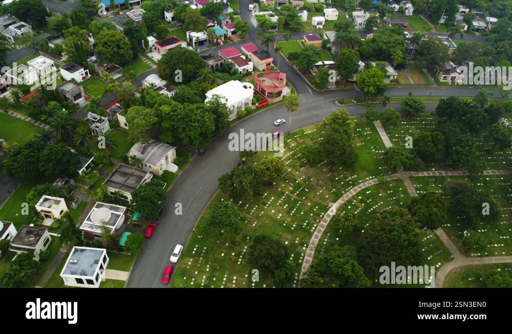 Drone tracking a car in the suburbs of Parañaque, summer day in ...