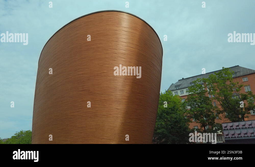 Slow-motion top-down reveal of Kamppi Chapel in Helsinki, a popular ...