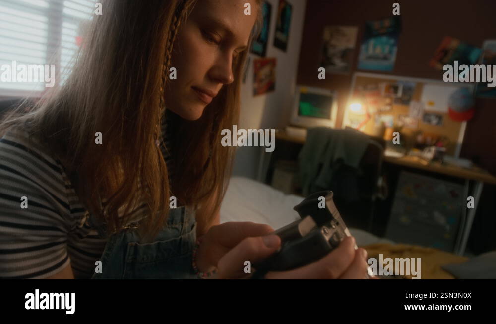 Gen Y Teenage Girl Learning How to Use Retro Video Camera in 1990s ...