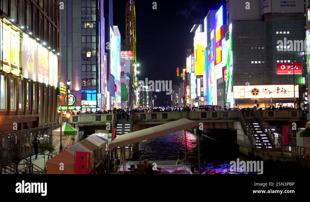 Osaka, Japan 5 May 2023 Dotonburi Glico sign bridge and canal tourist ...