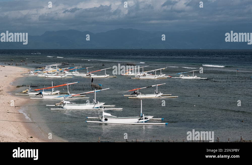 Tripod footage of traditional Balinese boats washed by the surf. Nusa ...