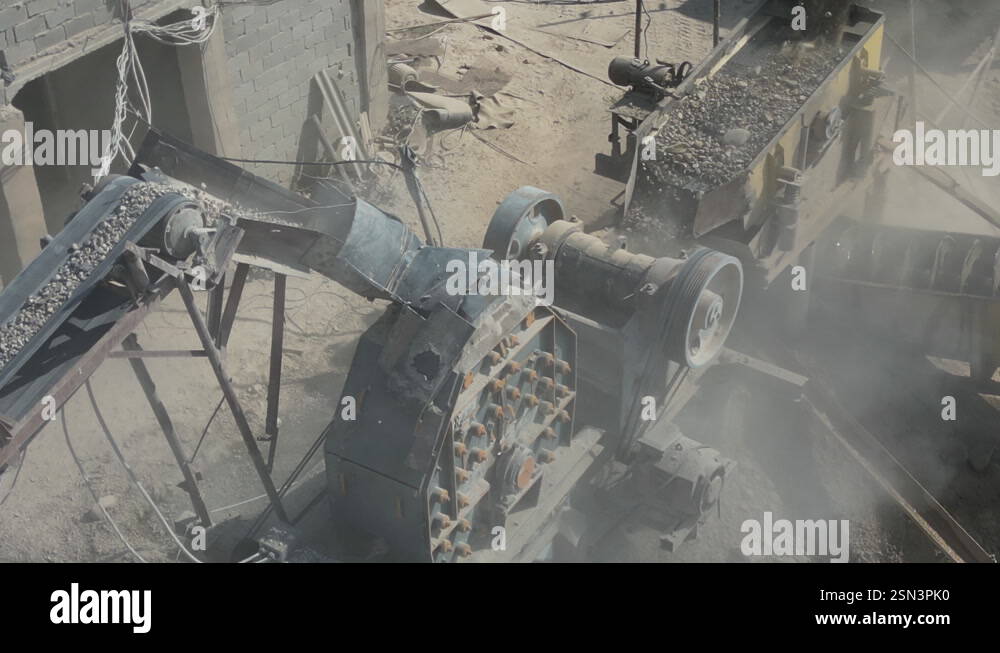 A mechanized process of crushing rocks into gravel Stock Video Footage ...