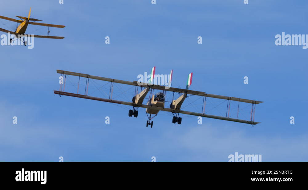 WWI Italian Caproni Ca.3 Bomber in Flight with Biplane Fighter Stock ...