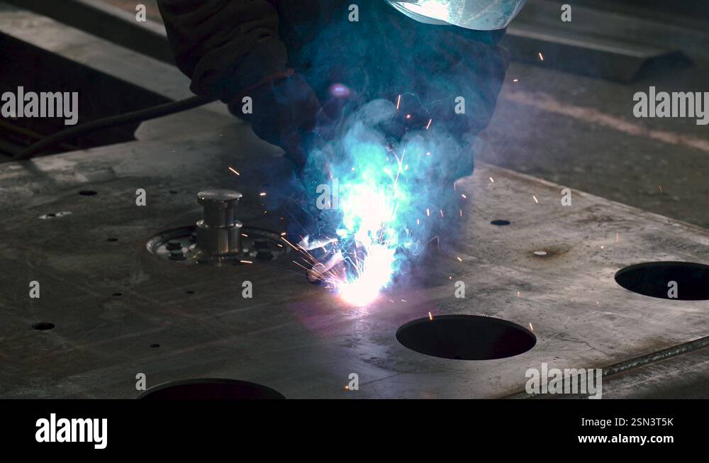 Precision welding in action at a busy manufacturing plant Stock Video ...