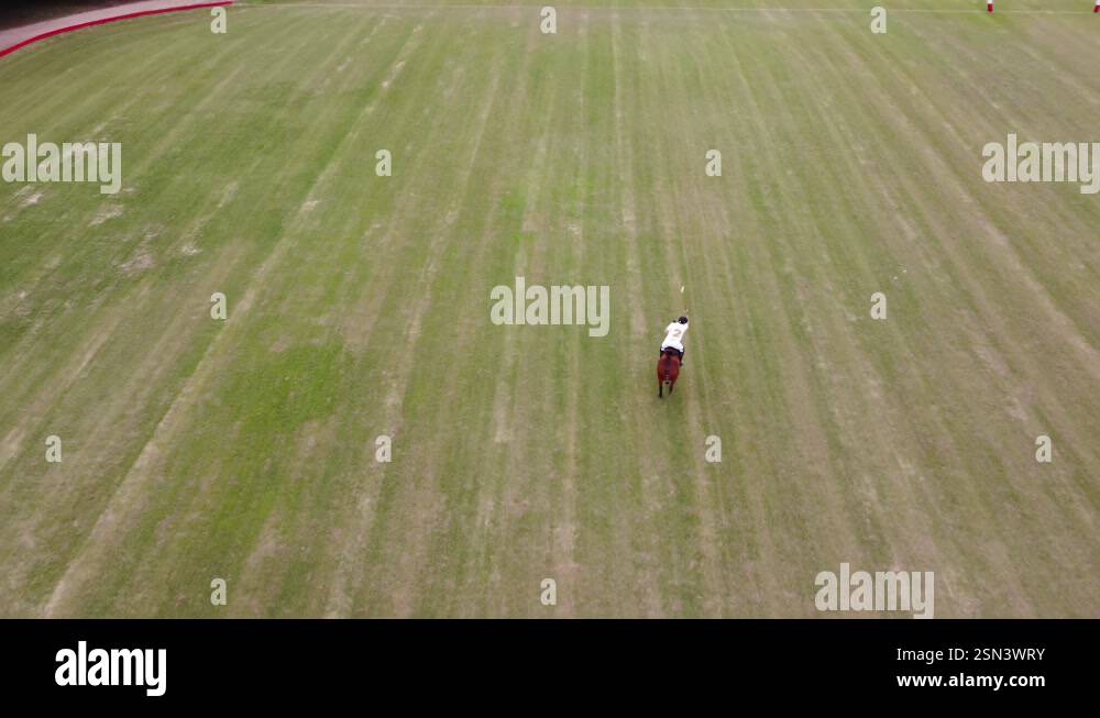 A drone captures an aerial view of a polo field on a beautiful spring ...