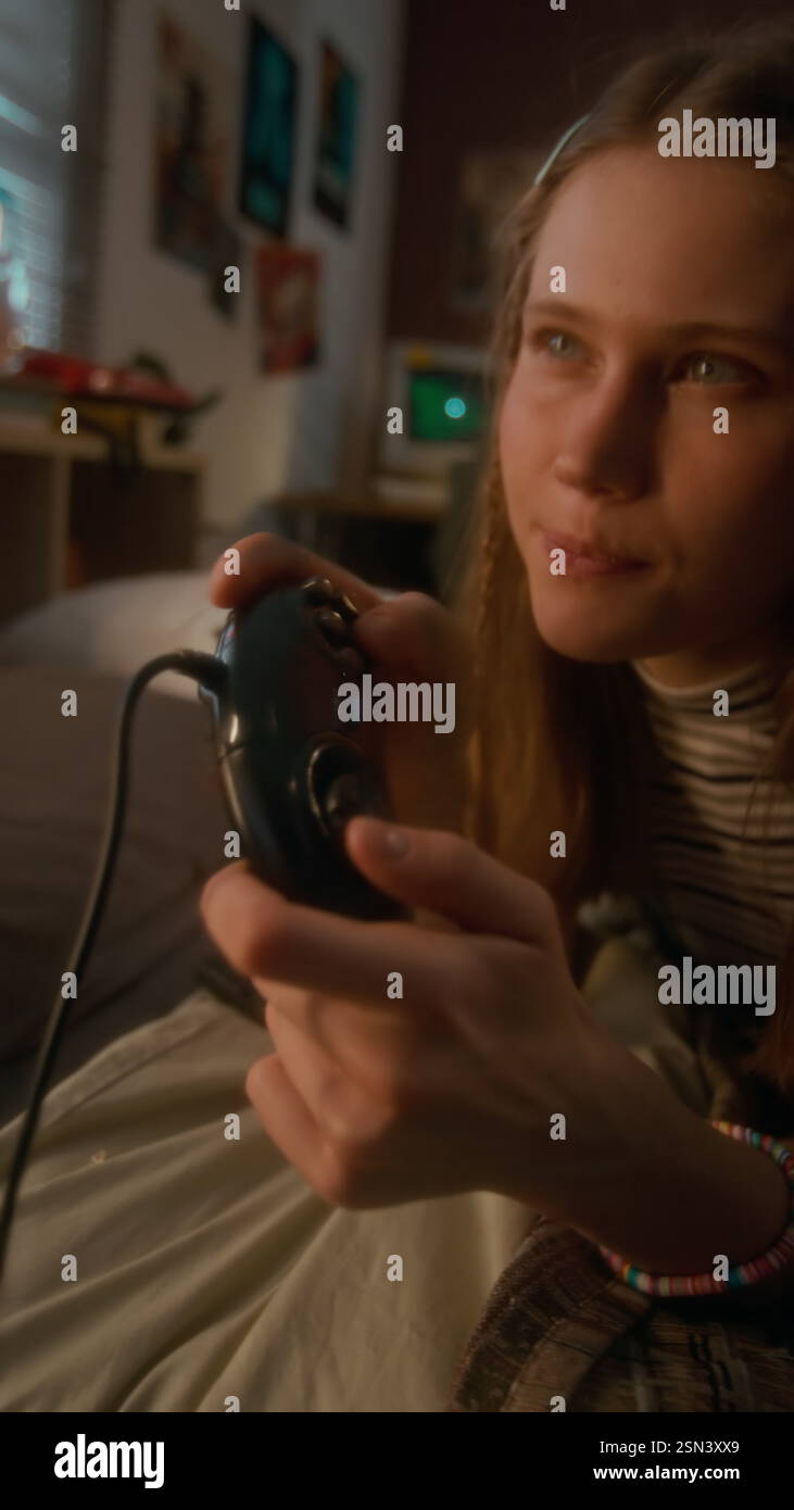 Vertical of Engaged Girl Playing Video Came on Retro Controller in 90s Stock Video Footage - Alamy