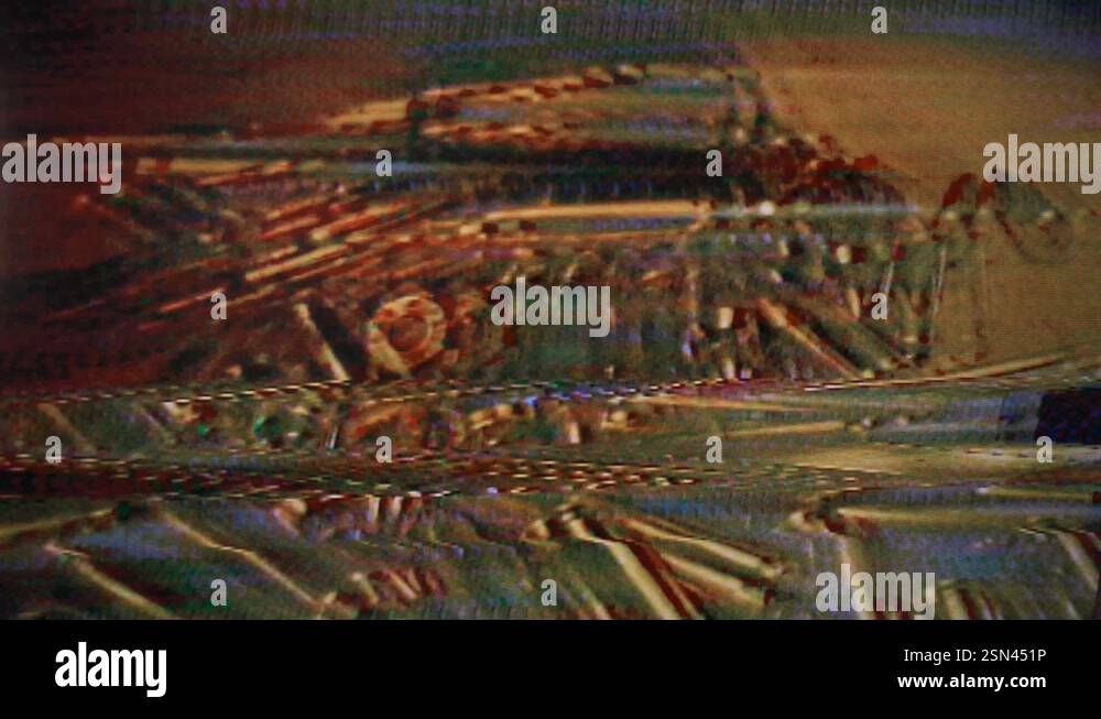 rounds of ammunition, bullets on display in heavy glitch distortion VHS ...