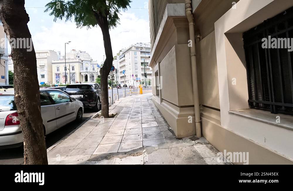 athens, Greece - 09/30/2024: Walking towards a busy street in Athens ...