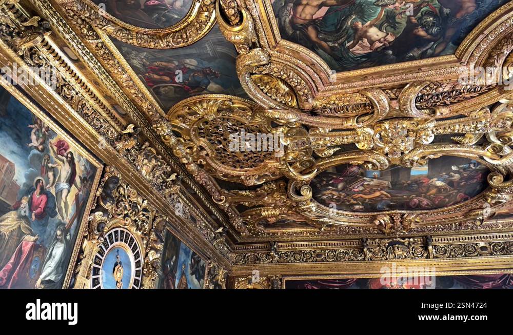 Ornate ceiling with rich paintings and gold details in Doge's Palace in ...