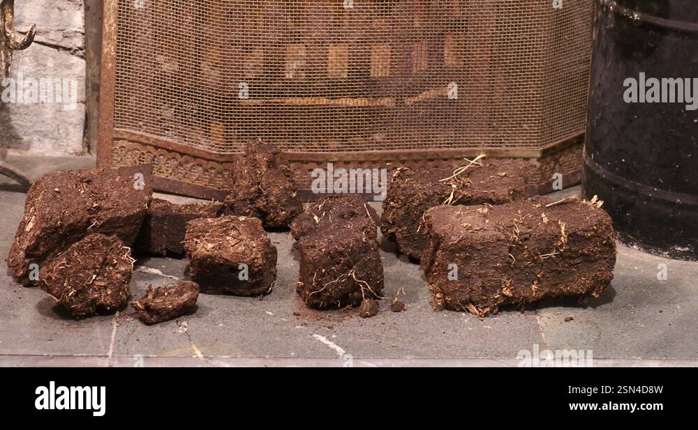 Peat being used as fuel on a house fire in Portnahaven on Islay ...