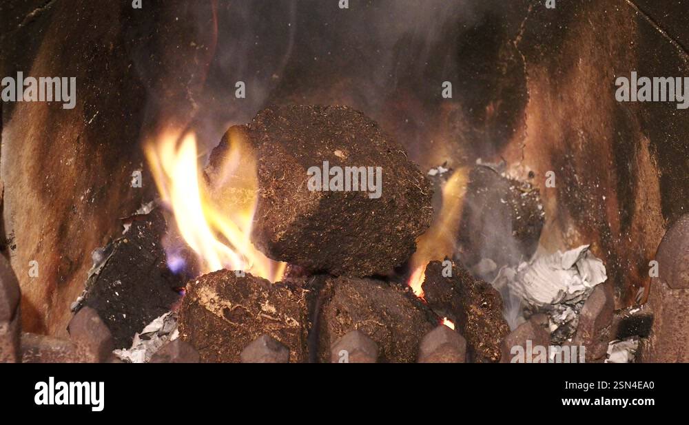Peat being used as fuel on a house fire in Portnahaven on Islay ...