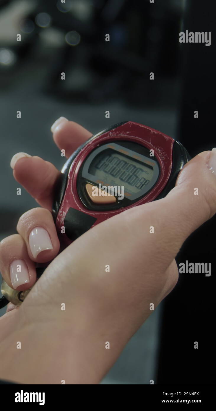 Hand of Female Fitness Instructor Using Stopwatch in Gym Stock Video ...