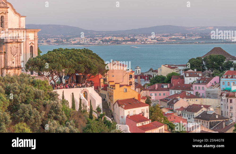 Tourists at Miradouro da Graca viewpoint looking over Lisbon aerial ...