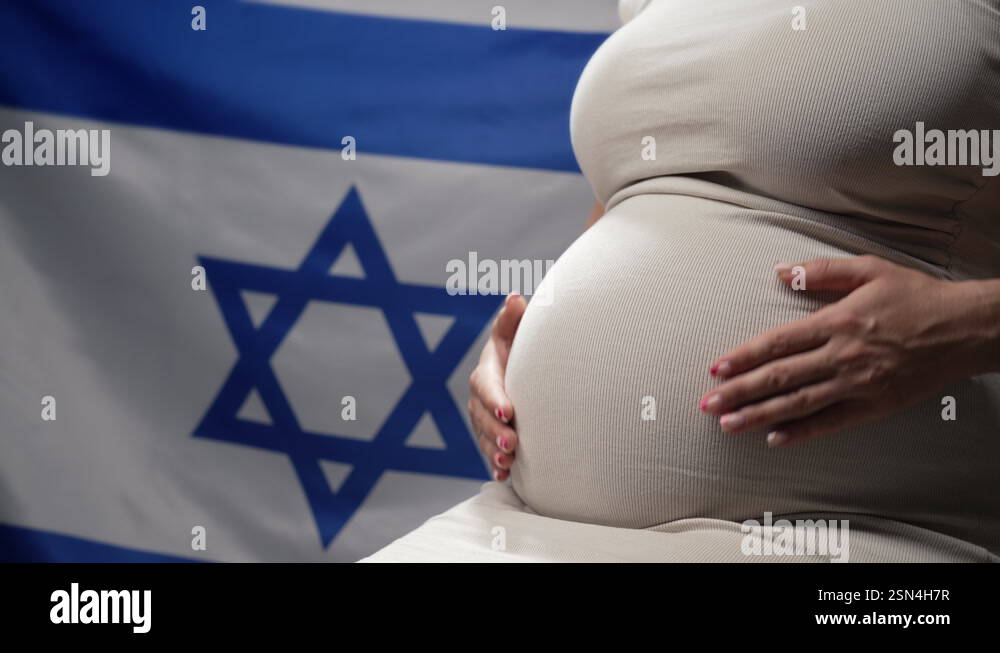 Unrecognizable future mother expecting baby on Israeli national flag ...