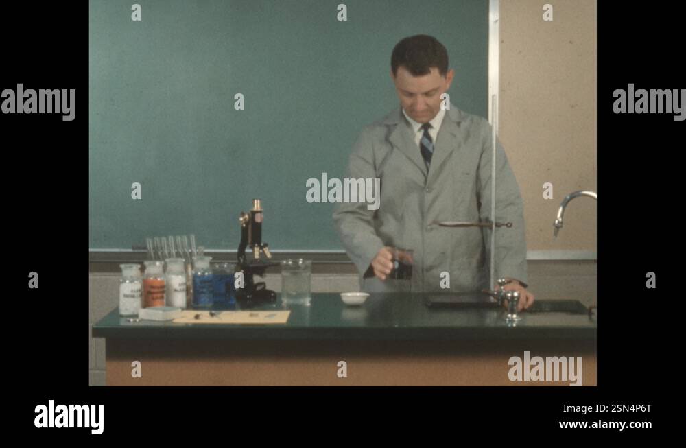 1950s: Man with equipment in lab, picks up beakers Stock Video Footage ...