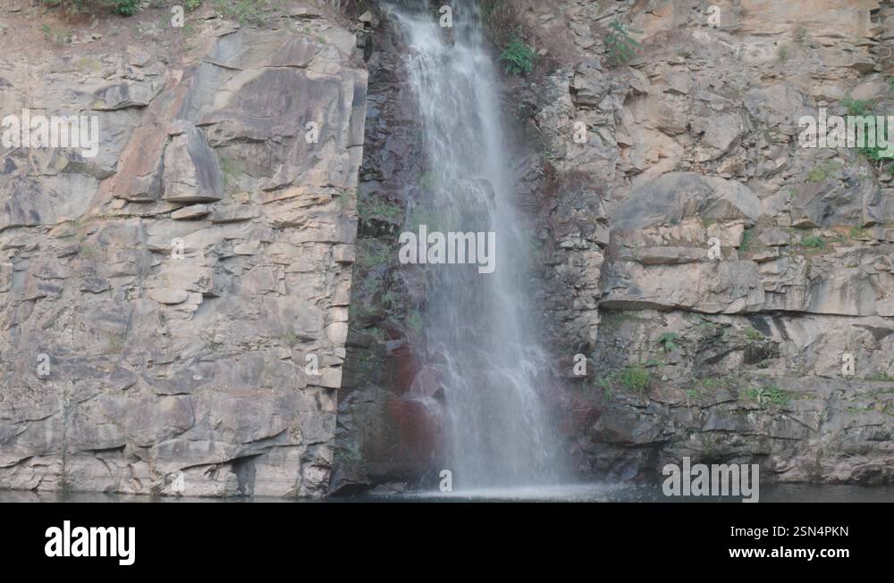 Tall Quarry Waterfall on a Rock Wall Stock Video Footage - Alamy