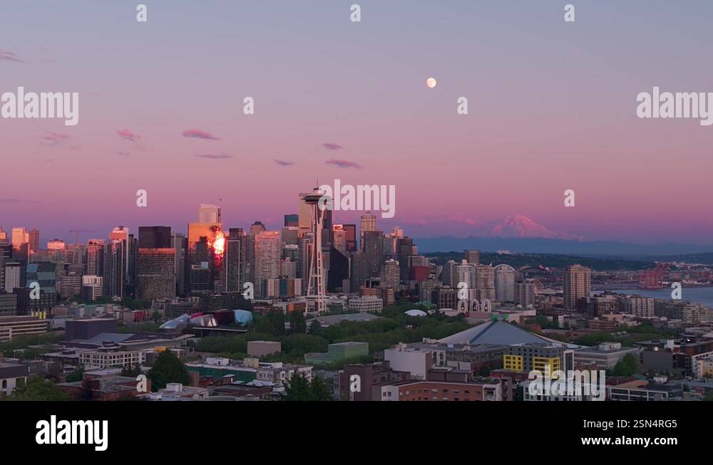 Seattle's skyline during sunset with the Space Needle and Mount Rainier ...