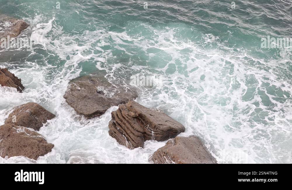 Sea wave rolls onto coastal Stock Videos & Footage - HD and 4K Video ...