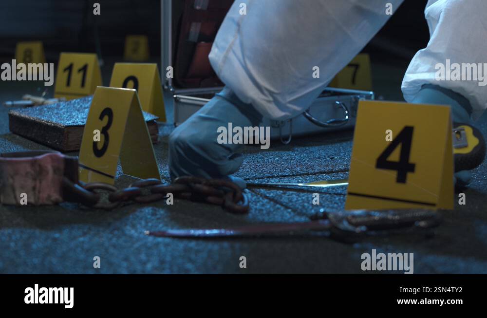 Forensic expert hard working at ritualistic crime scene with occult ...
