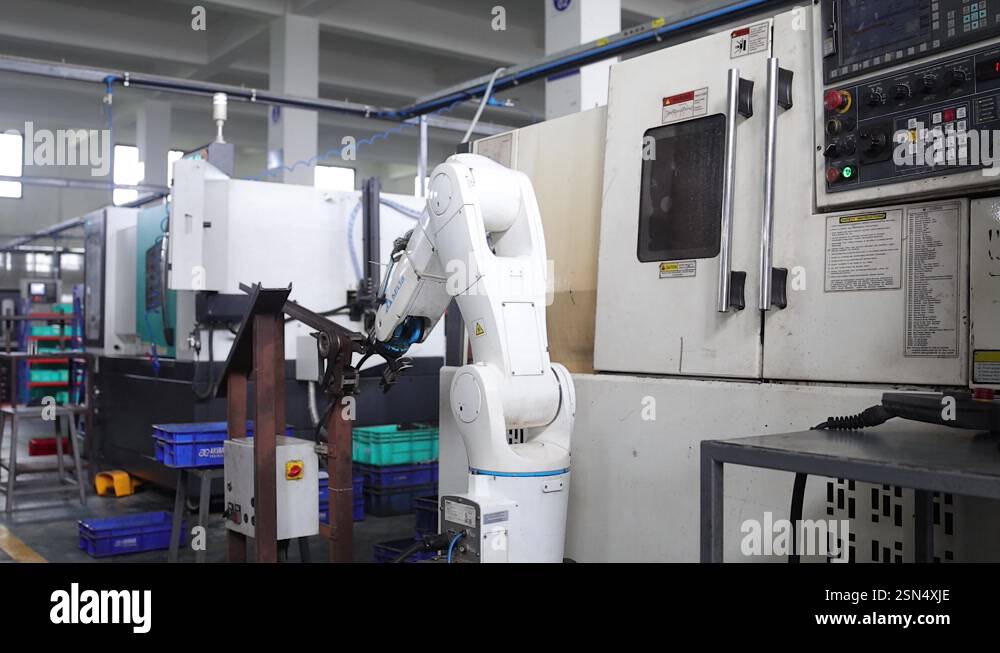 robotic arm taking a part putting inside a machine Stock Video Footage ...