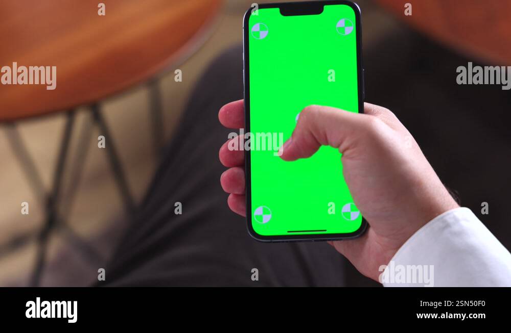 Scrolling pages on smartphone with vertical green screen and tracking ...