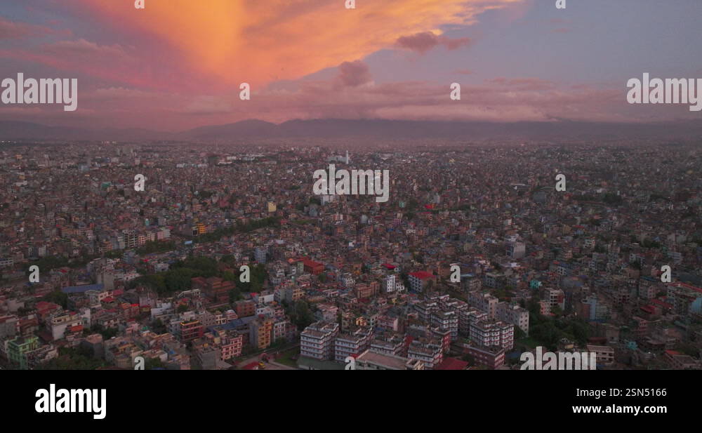 Bird-eye view of Kathmandu, Nepal golden hour with a glowing sunset sky ...