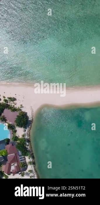 Sandbar surrounded by clear water and beachfront resorts. Ko Ma Beach ...