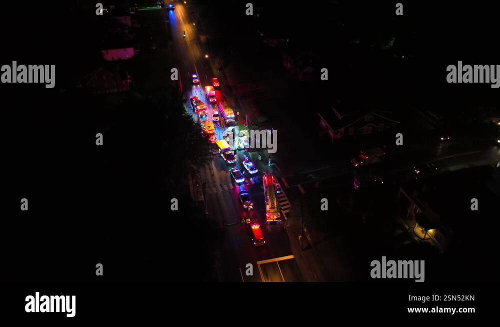 Accident scene on Main Street of american town at night. Flashing ...