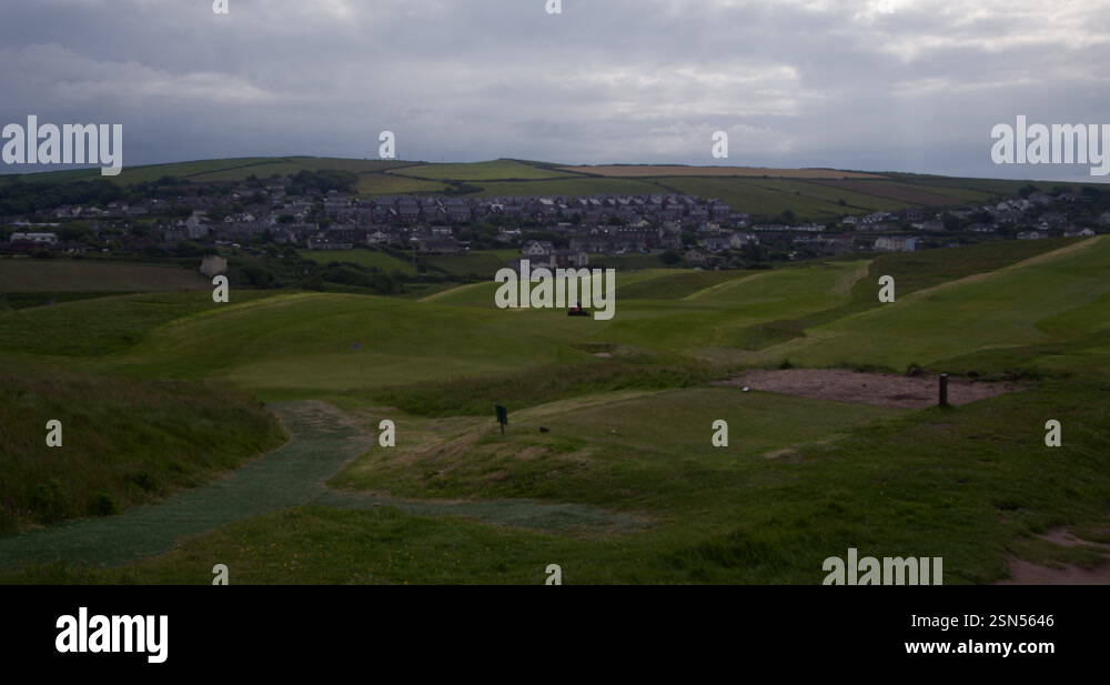 Wide shot of St bees Golf Club with the village of St bees in ...