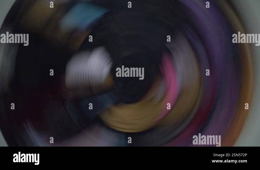 Process of washing and spinning clothes in a top loader washing machine ...