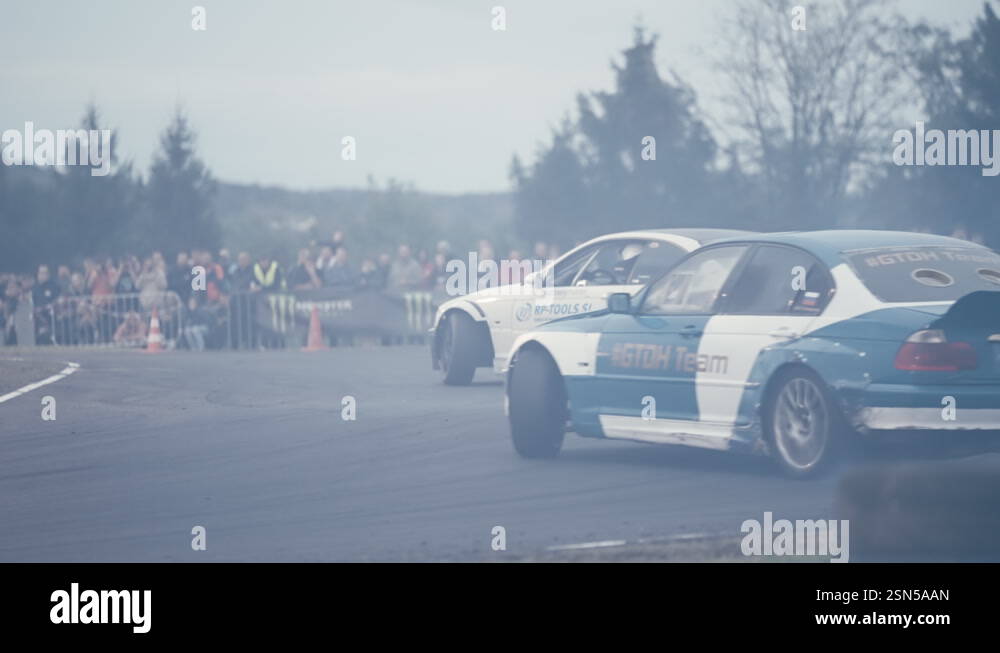 Two race cars drift into the frame side by side in slow motion 4K Stock ...