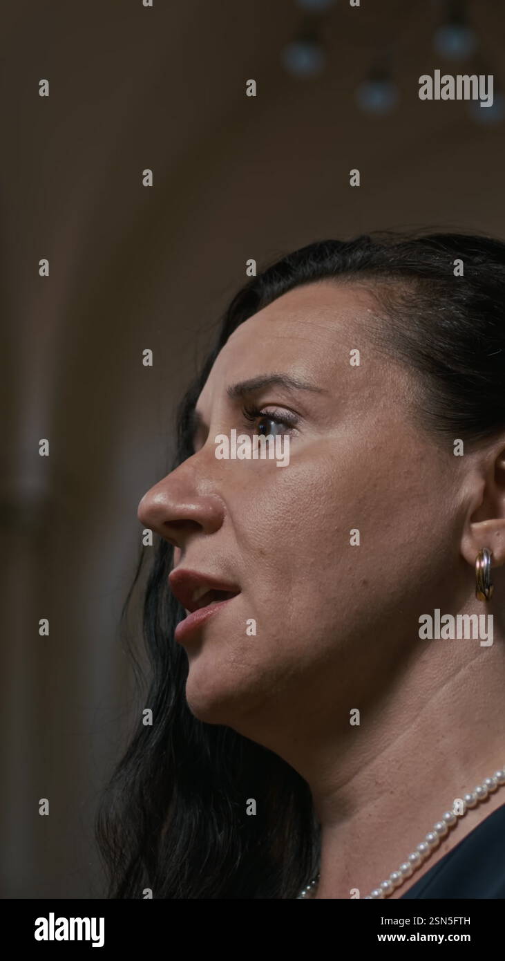 Close-up of Long-haired Female Vocalist Singing Worship Song in Temple ...