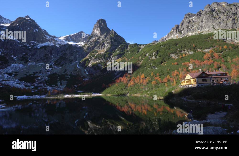 A cozy mountain hut by an alpine lake in the High Tatras, Slovakia ...