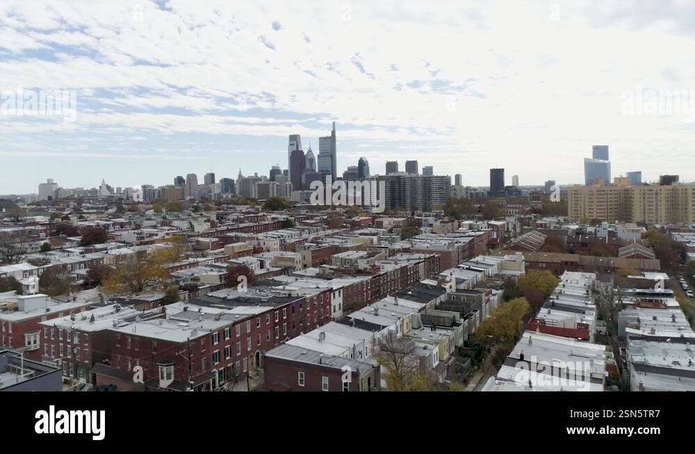 Aerial over Philadelphia Pennsylvania buildings and homes approaching ...