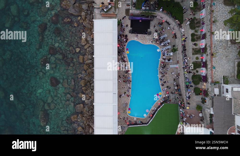 aerial top down of luxury resort with swimming pool in Capri island ...